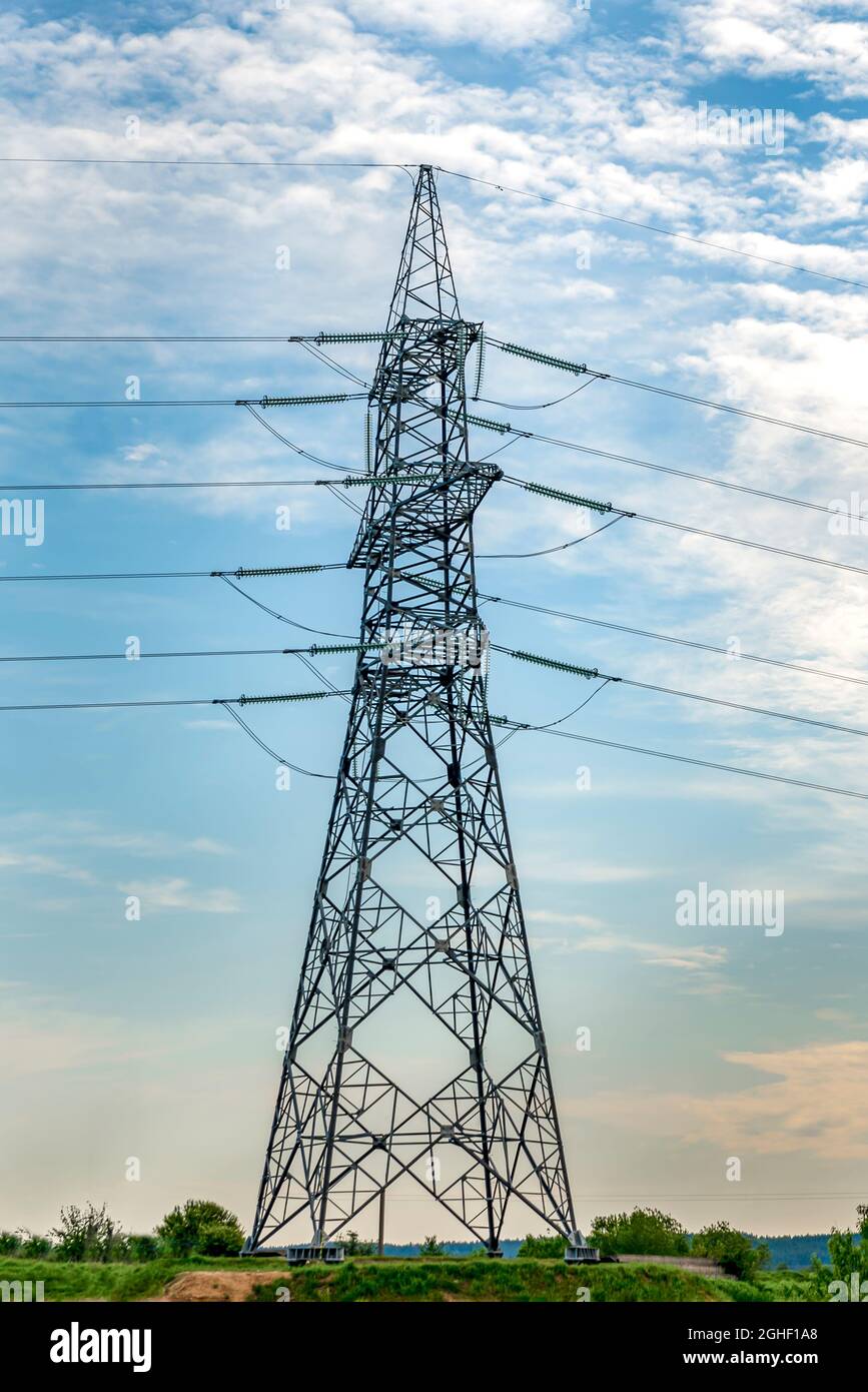 High voltage pillar. Power grid pole against the sky. High voltage ...