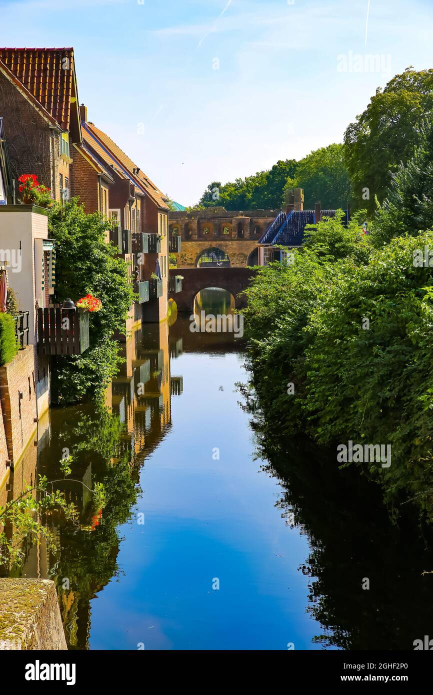 View over water canal on with houses and trees medieval watergate stone ...