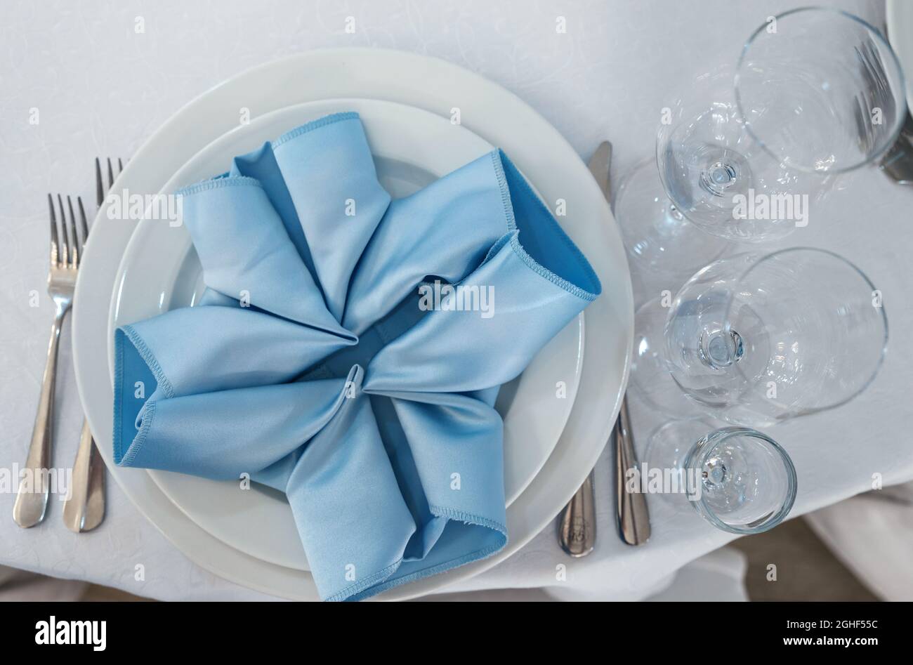 Beautiful table setting on white linen tablecloth. Festive luxury table ...