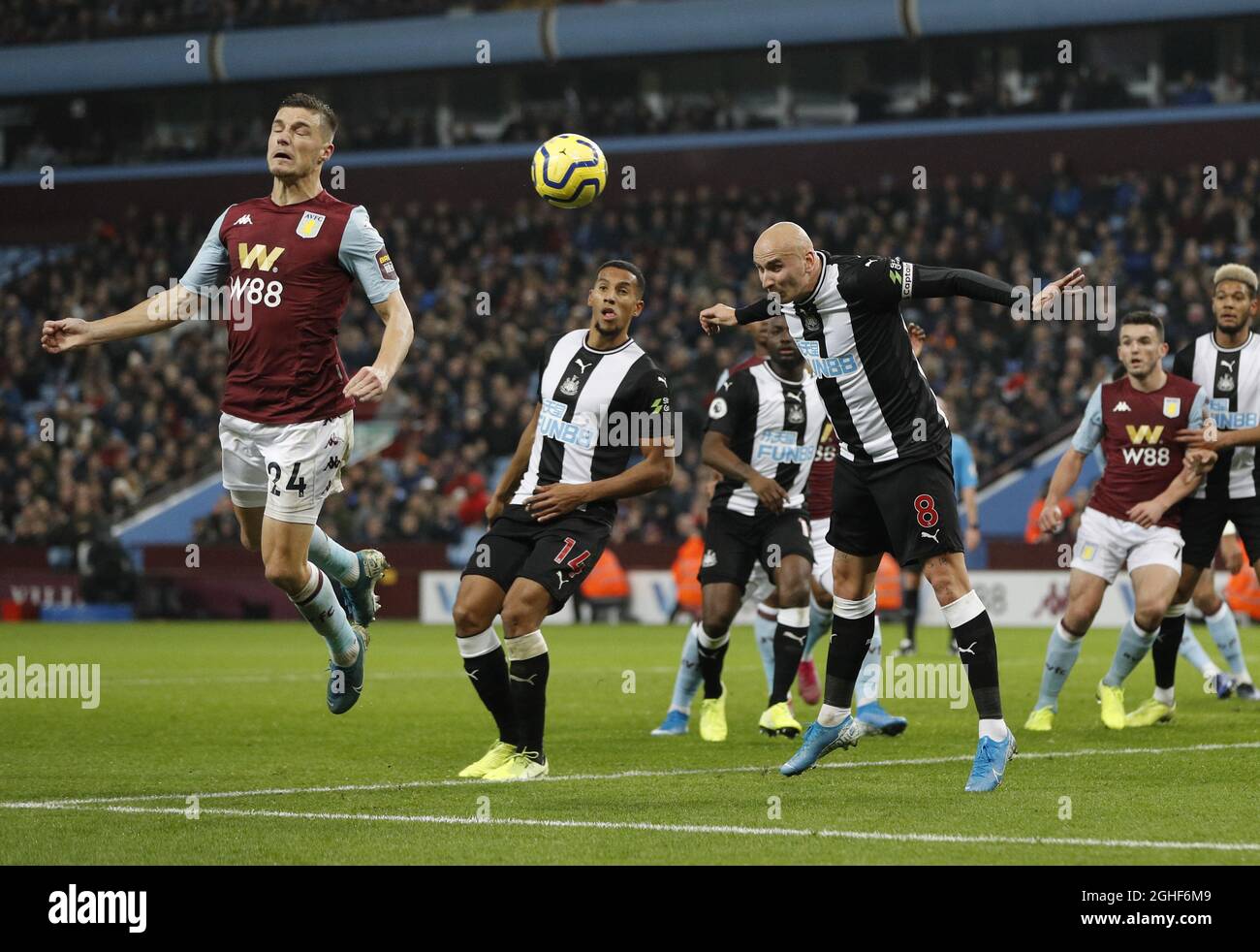 Frederic Guilbert of Aston Villa flicks past Jonjo Shelvey of Newcastle ...