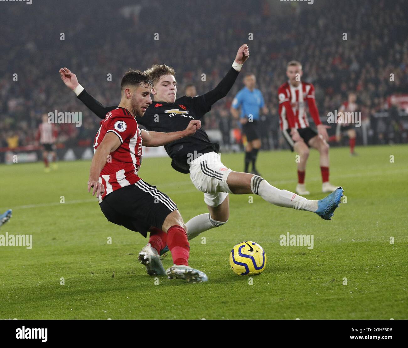 George Baldock of Sheffield Utd and Brandon Williams of Manchester ...