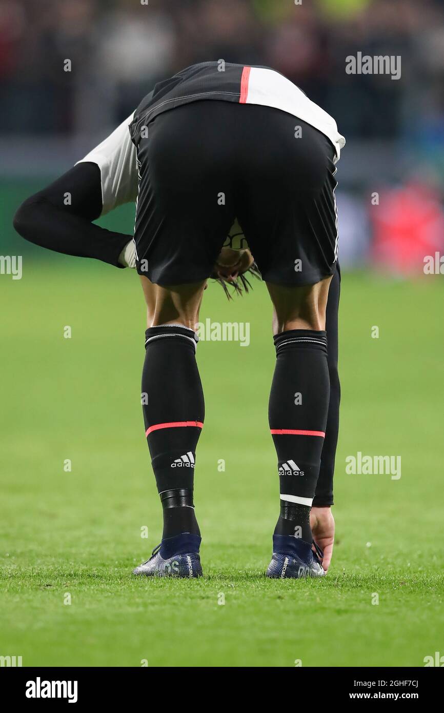 Cristiano Ronaldo of Juventus holds his toe after kiciing and breaking ...