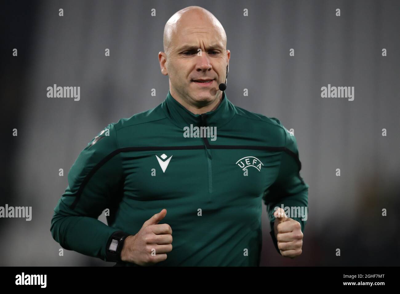 The referee Anthony Taylor warms up before the UEFA Champions League ...