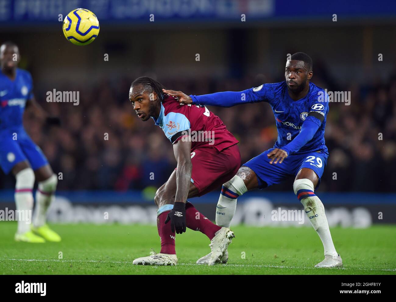 Michail Antonio of West Ham United is challenged by Fikayo Tomori of ...