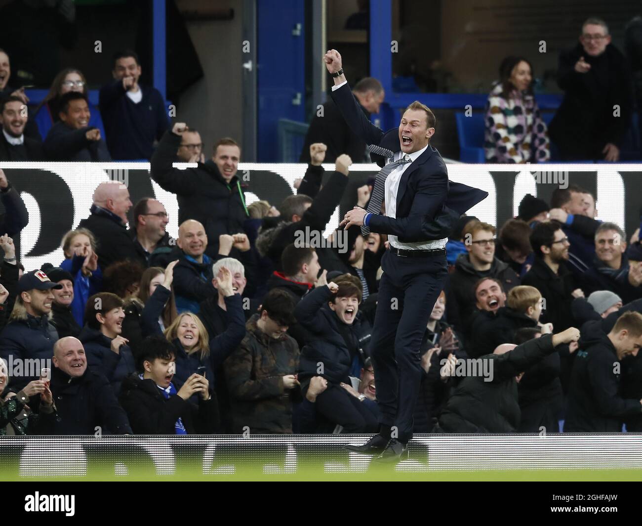 Duncan Ferguson stand in manager of Everton celebrates their third goal ...