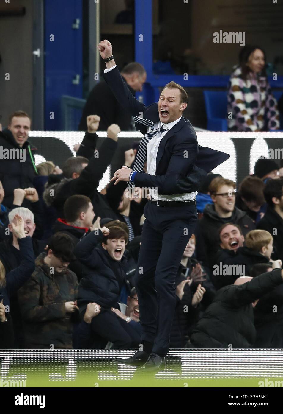 Duncan Ferguson stand in manager of Everton celebrates their third goal ...