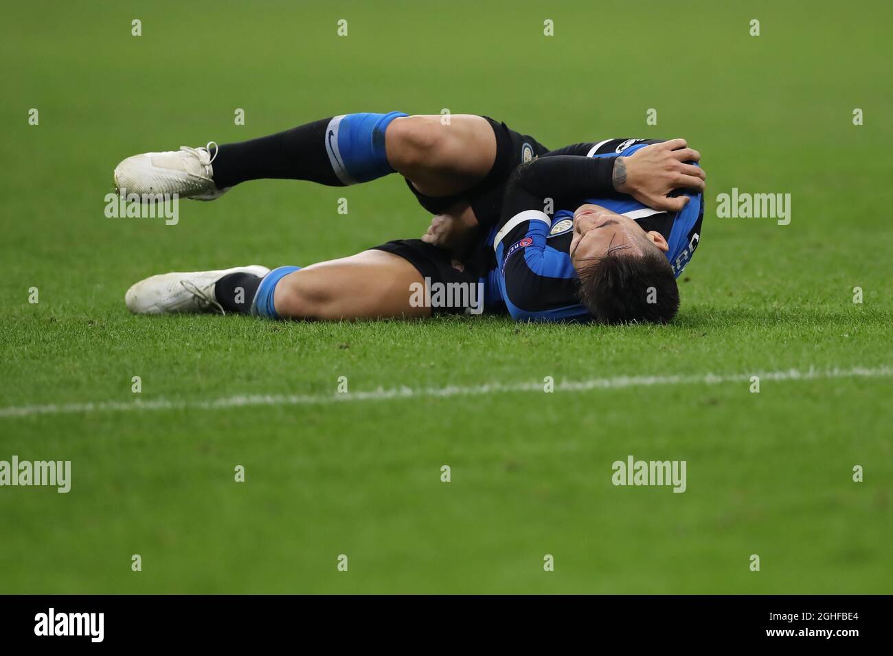 Lautaro Martinez of Inter lays injured during the UEFA Champions League ...