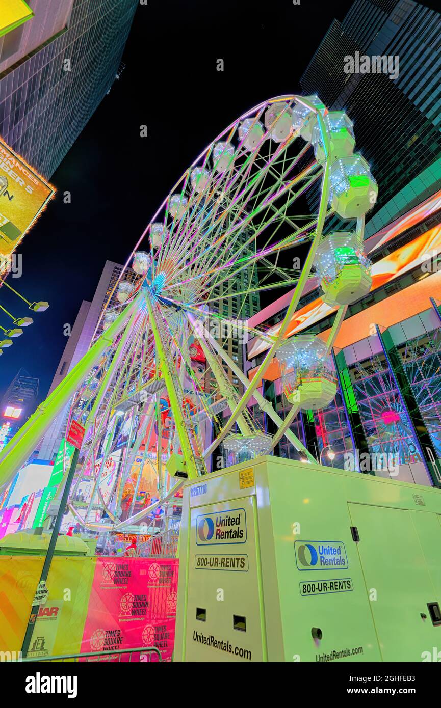 Times Square Wheel, a 110-foot-tall amusement, is a temporary tourist ...