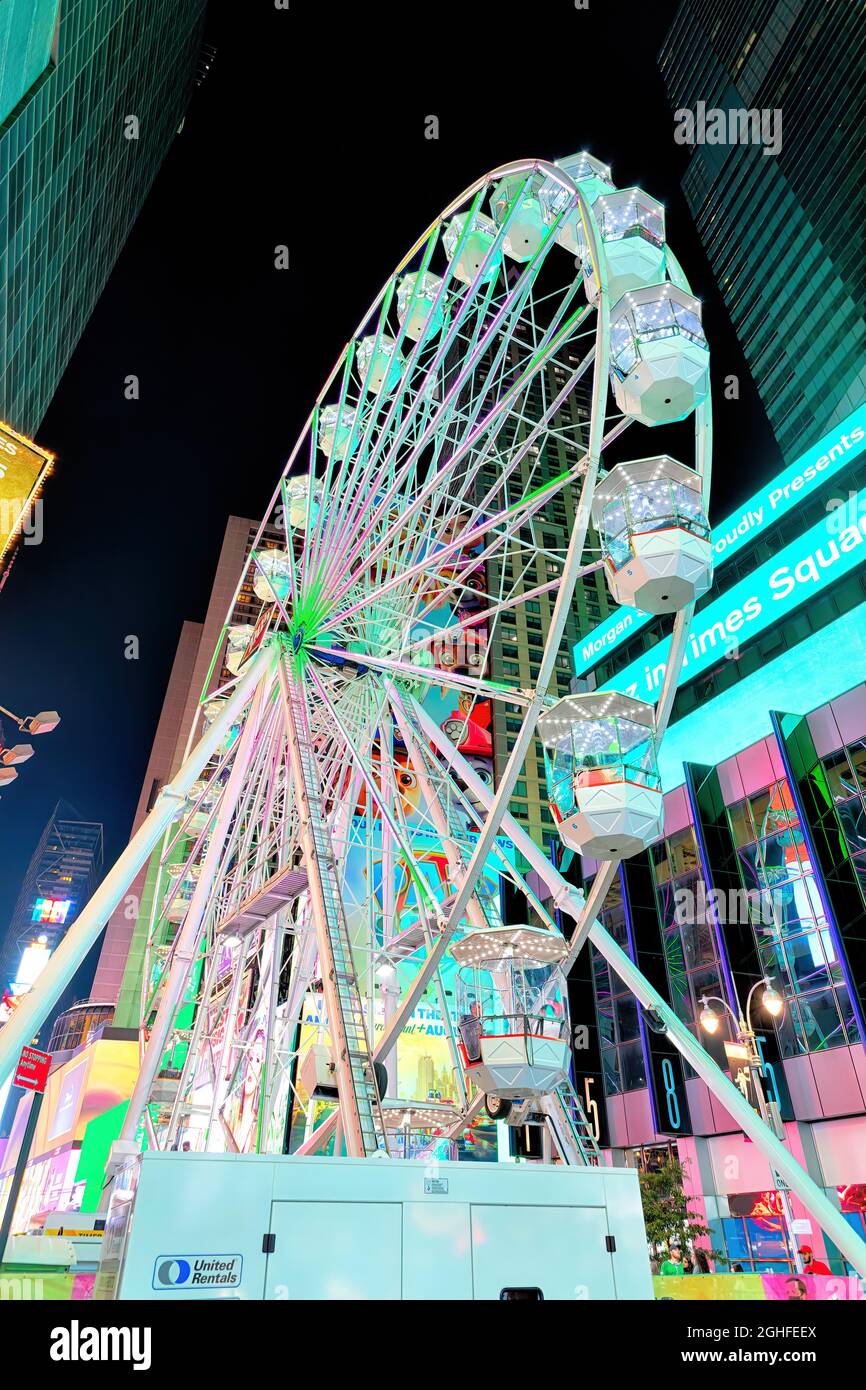 Times Square Wheel, a 110-foot-tall amusement, is a temporary tourist ...