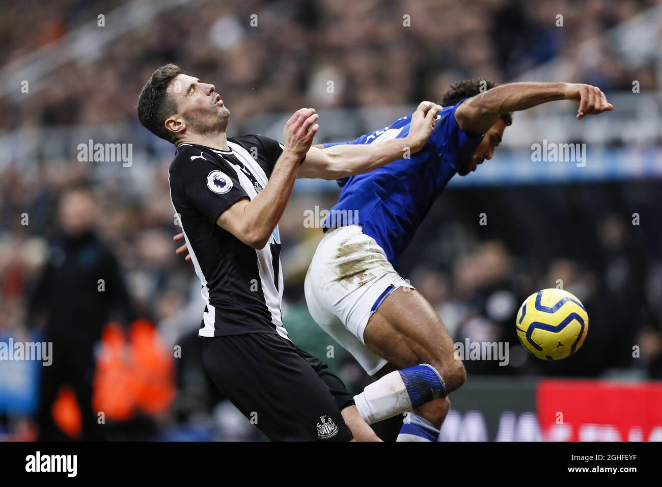 Dominic Calvert-Lewin of Everton catches Fabian Schlar of Newcastle ...