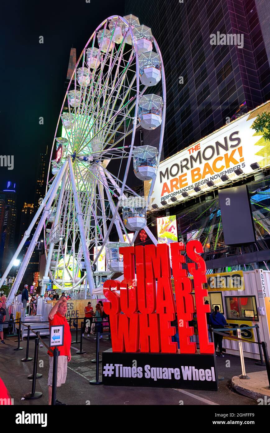 Times Square Wheel, a 110-foot-tall amusement, is a temporary tourist ...