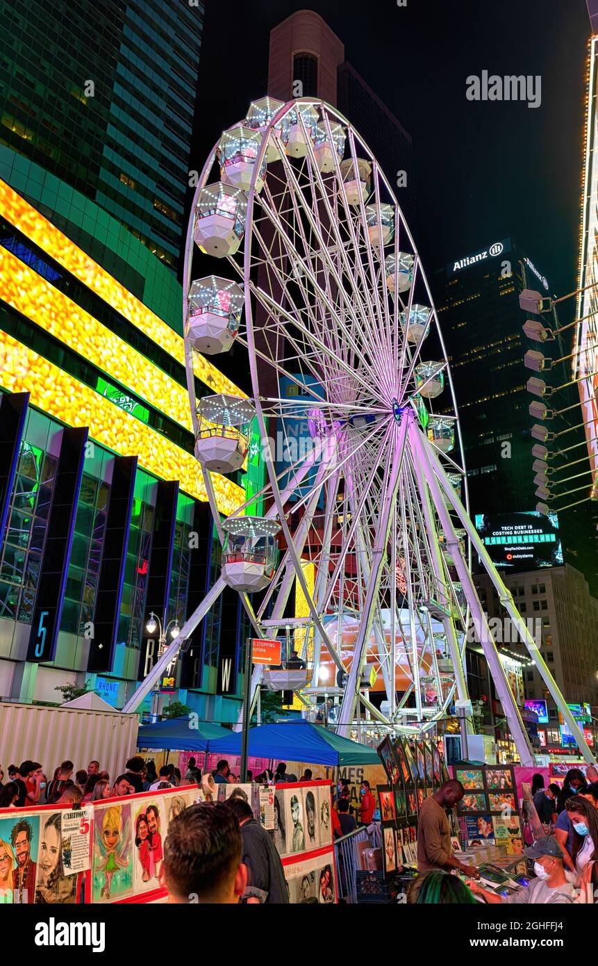 Times Square Wheel, a 110-foot-tall amusement, is a temporary tourist ...