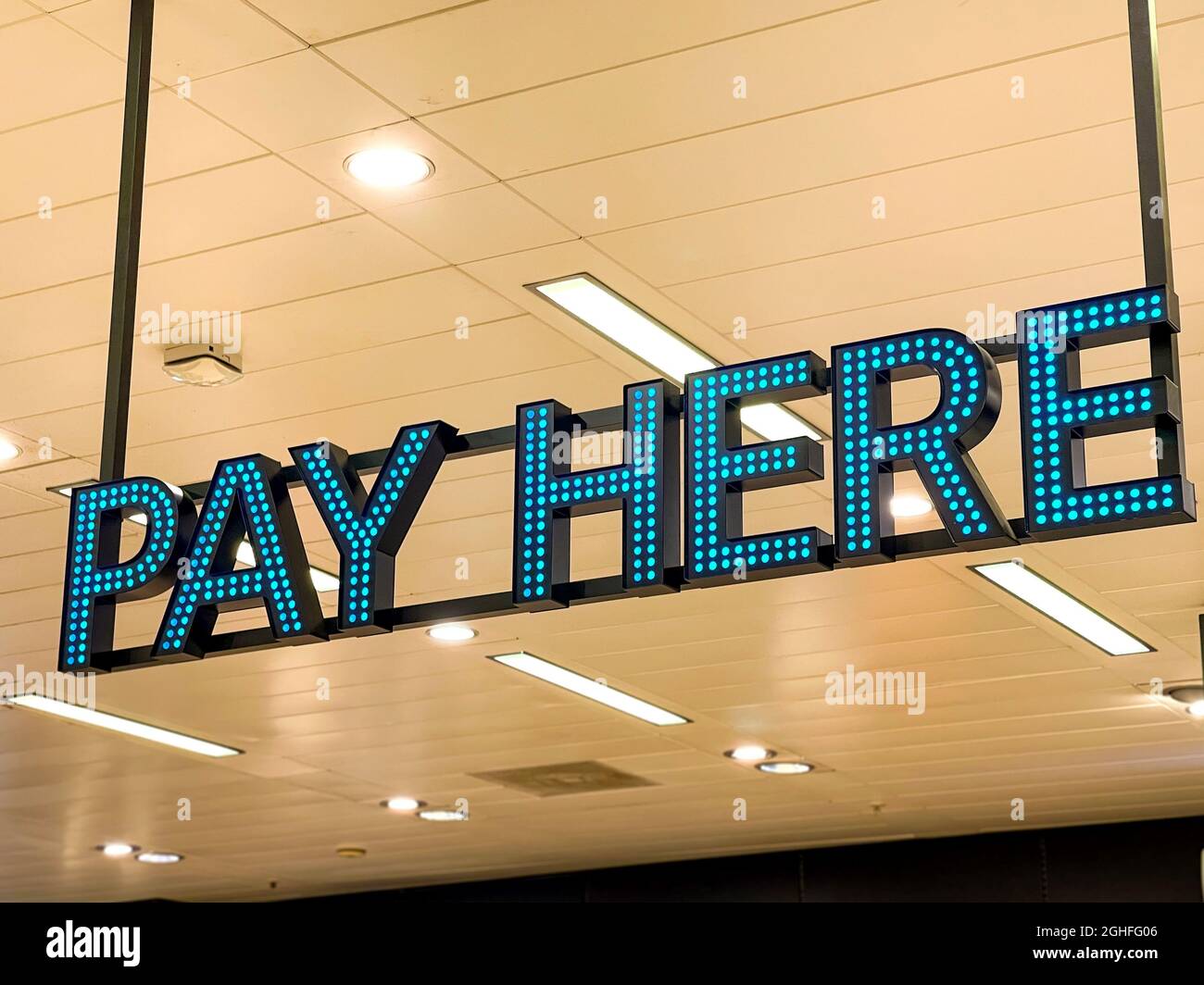 London, England - August 2021: Illuminated sign in a shop showing ...
