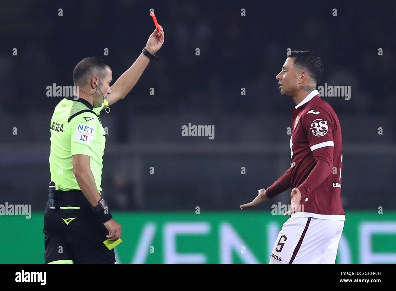 Armando Izzo of Torino FC is shown the red card by referee Marco Guida ...