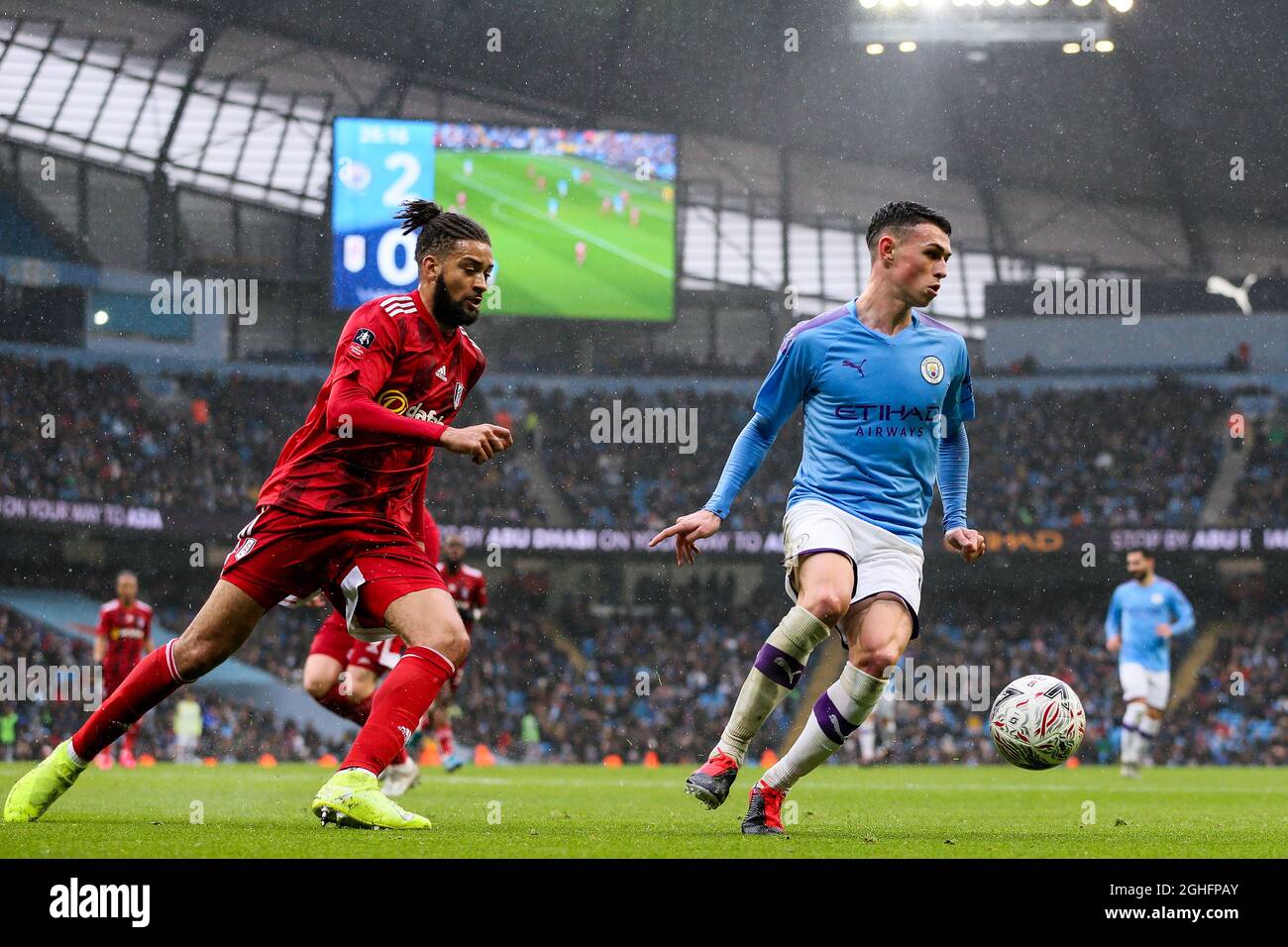 Michael Hector of Fulham and Phil Foden of Manchester City during the ...