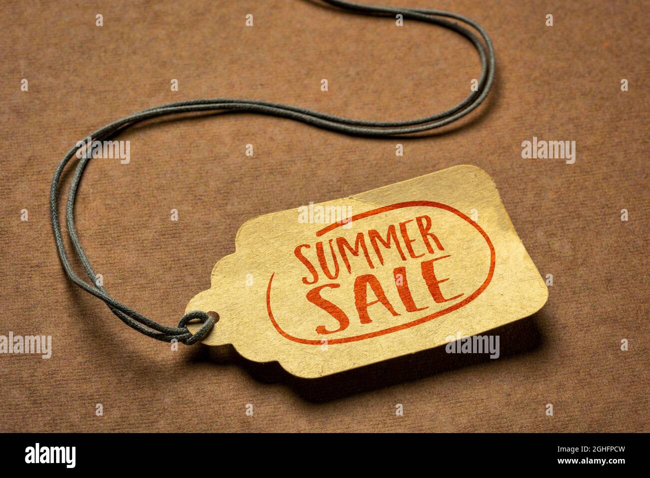 summer sale sign - a paper price tag against grunge paper background ...