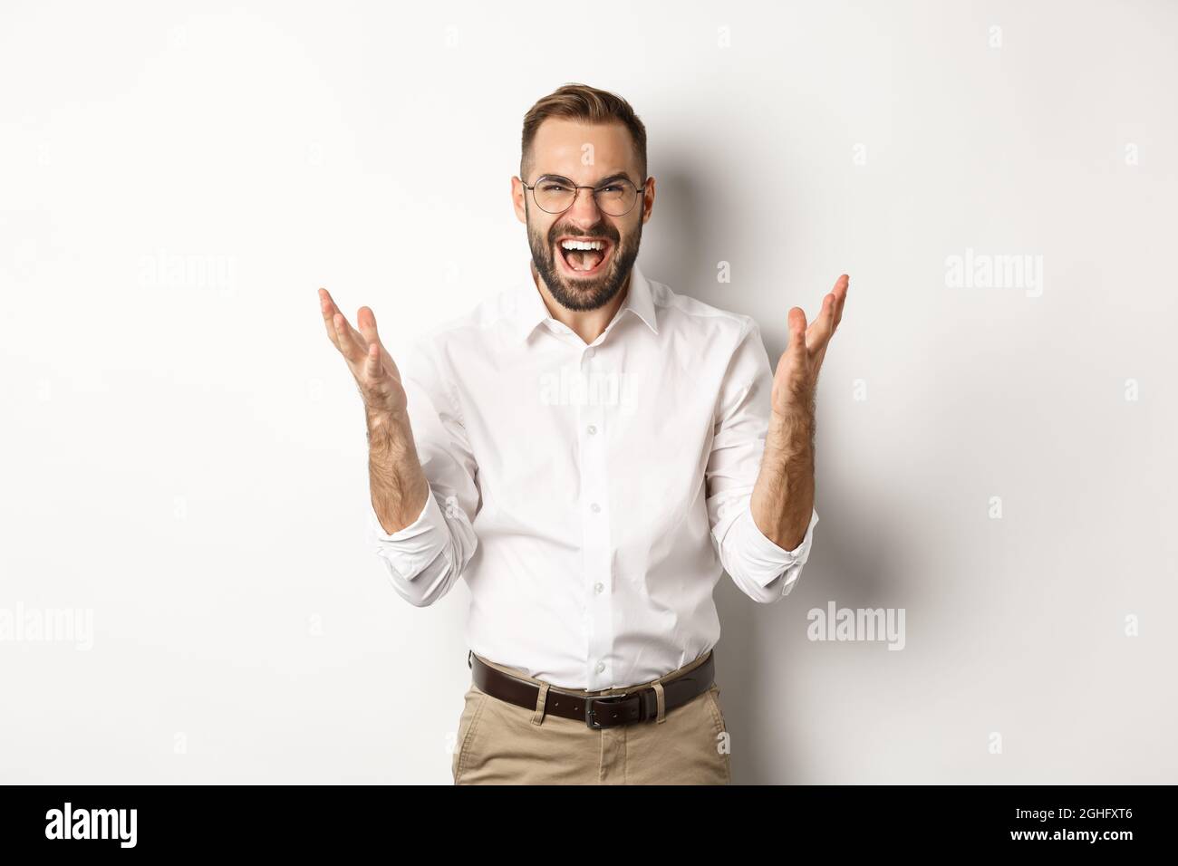 Frustrated and angry man screaming in rage, shaking hands furious ...