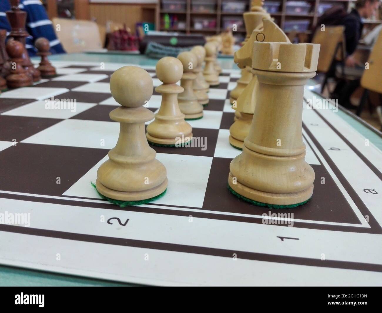 Figurines on chessboard hi-res stock photography and images - Alamy