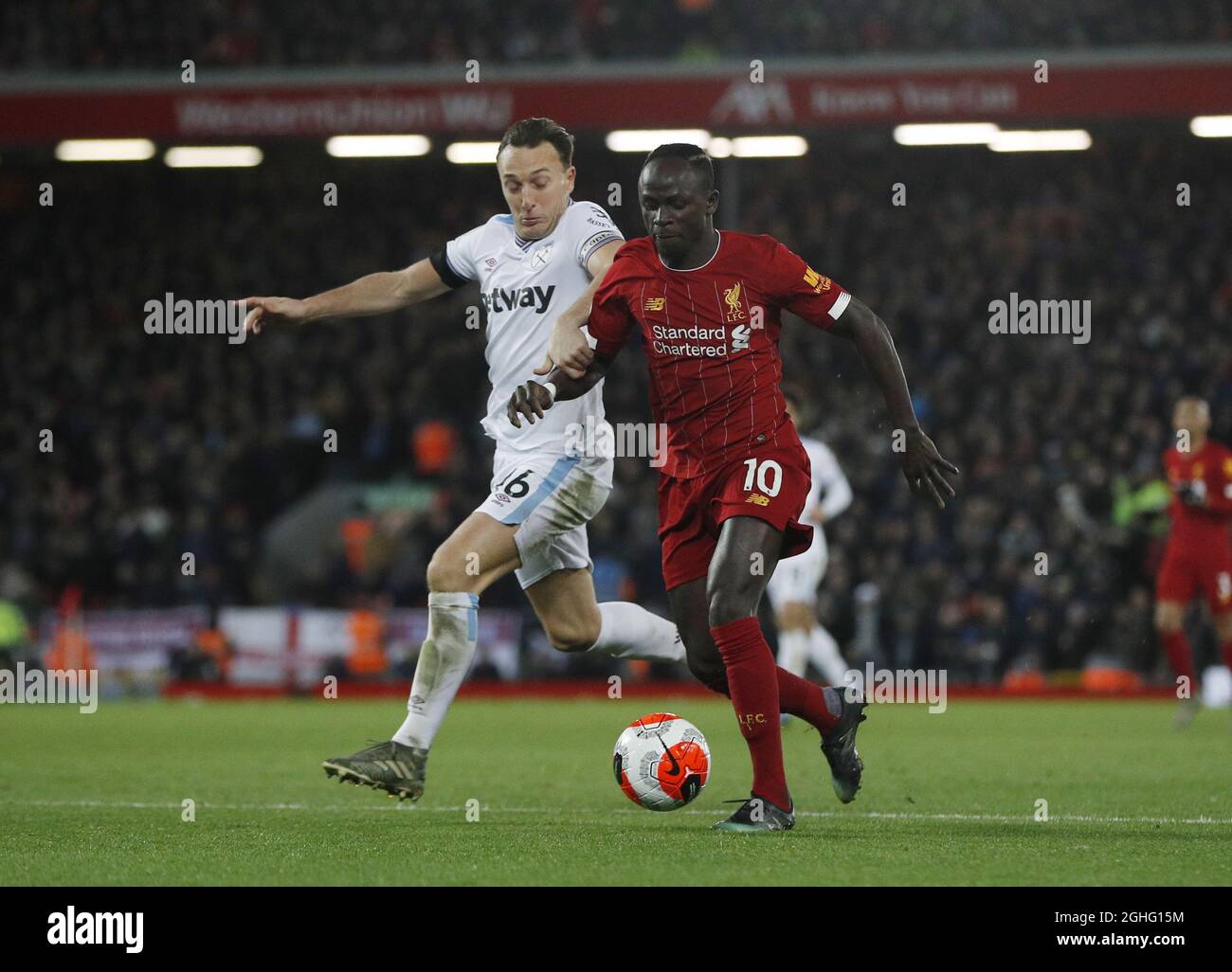 Sadio Mane of Liverpool tackled by Mark Noble of West Ham United during ...