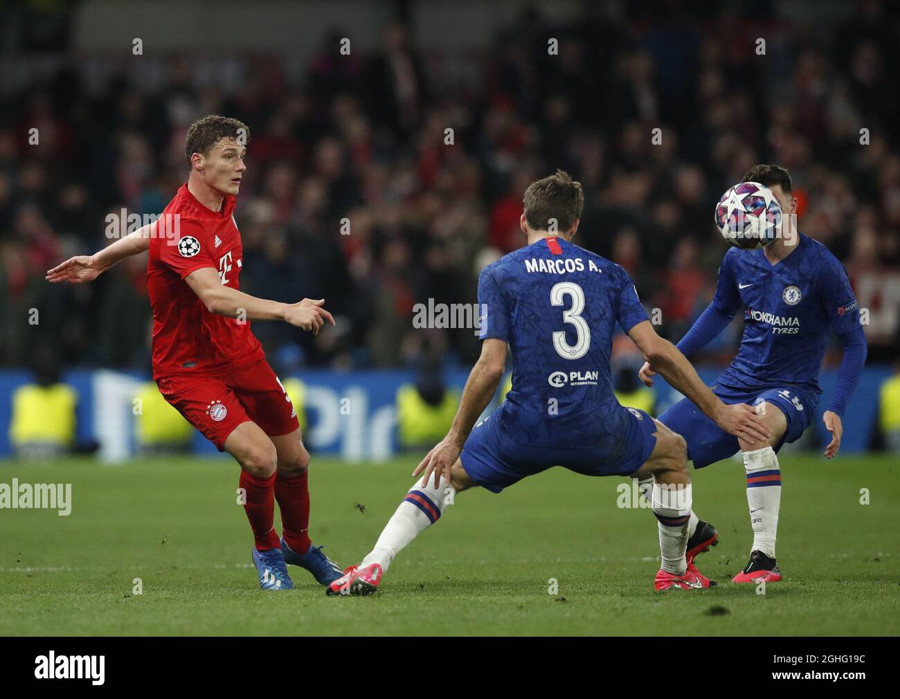 Benjamin Pavard of Bayern Munich plays past Marcos Alonso of Chelsea ...