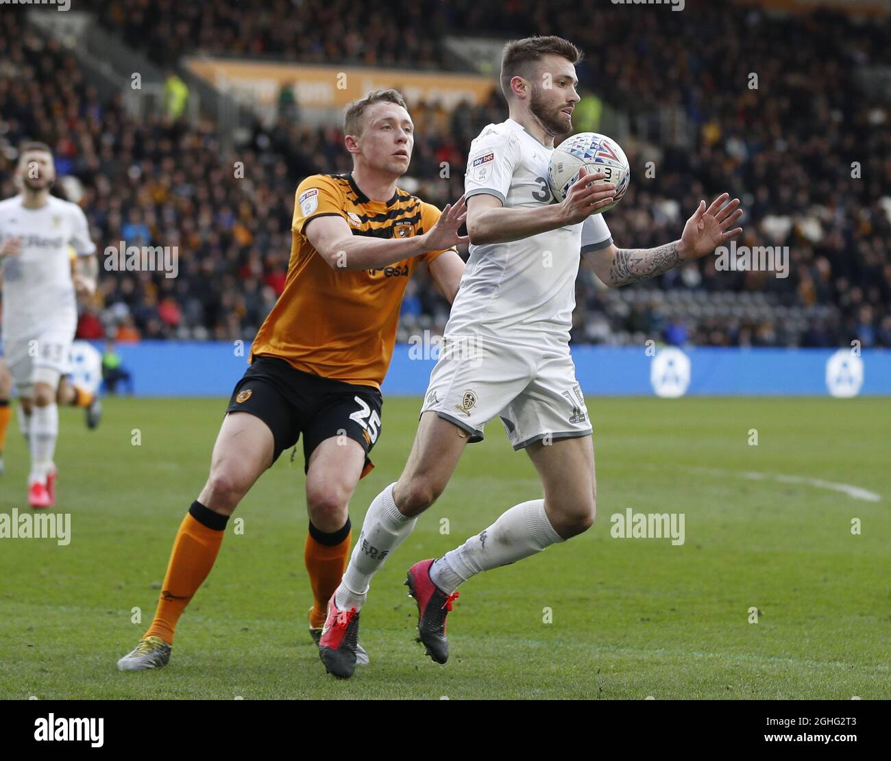 Matthew Pennington of Hull City challenges Stuart Dallas of Leeds ...