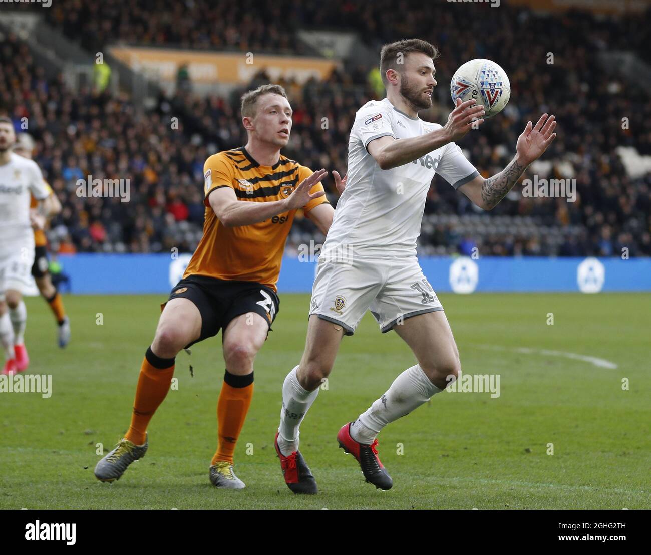 Matthew Pennington of Hull City challenges Stuart Dallas of Leeds ...