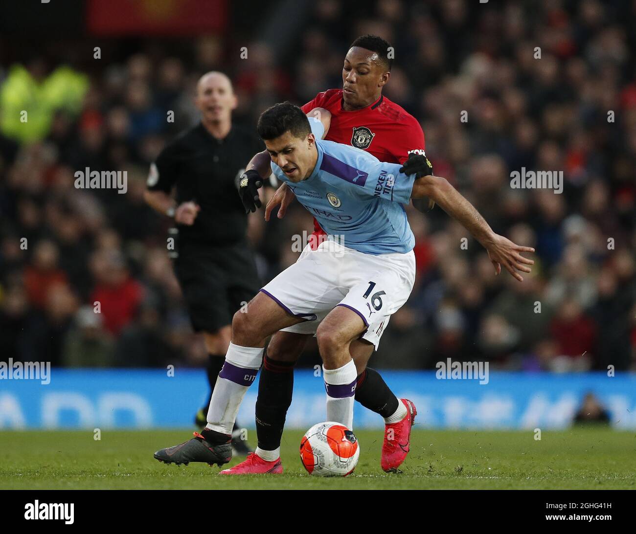 Anthony Martial of Manchester United tackles Rodrigo of Manchester City ...