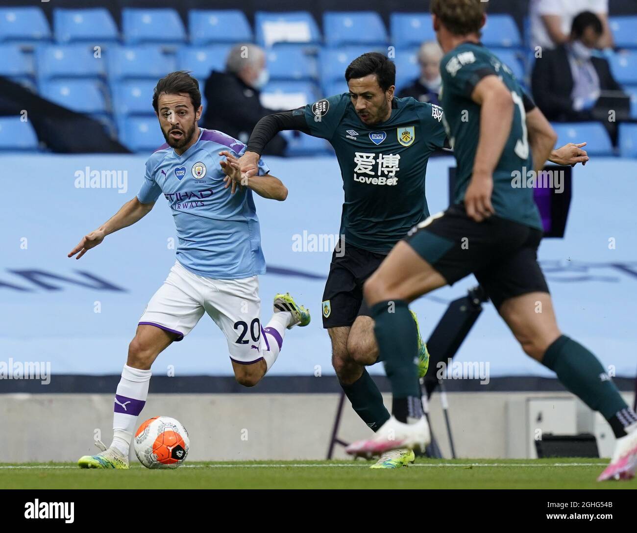 Bernardo Silva of Manchester City tackled by Dwight McNeil of Burnley ...