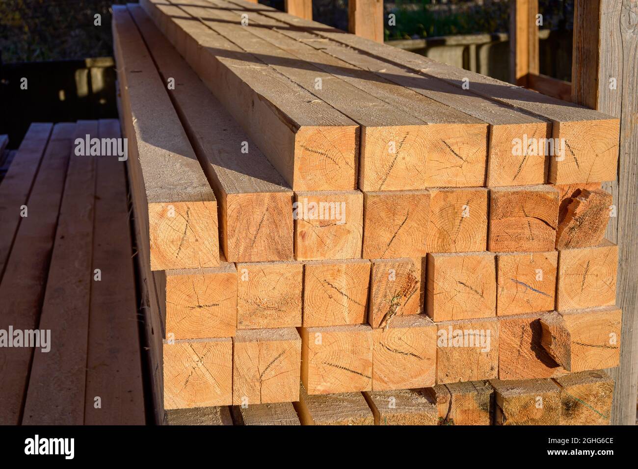 Piles of wooden planks at the sawmill for the manufacture of cladding ...