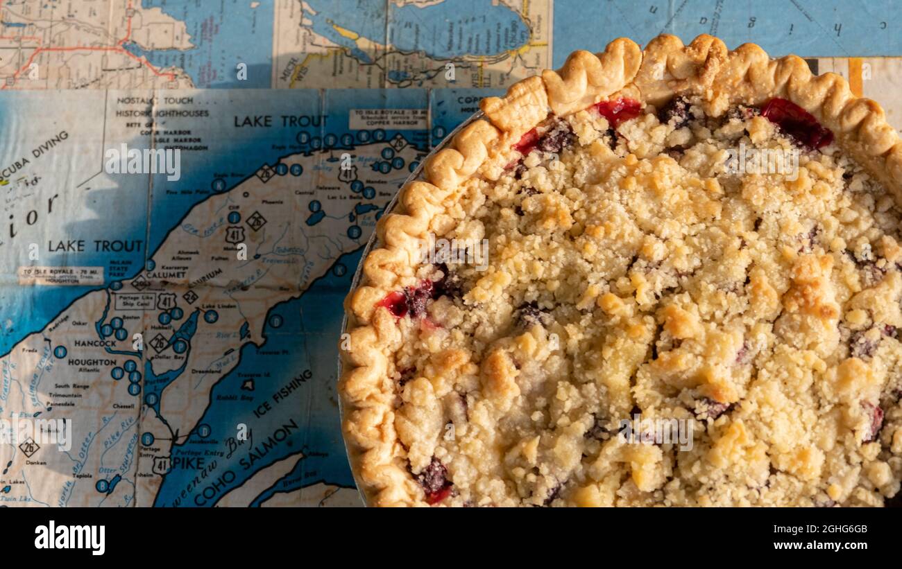Top view of a freshly baked apple pie on a map Stock Photo - Alamy