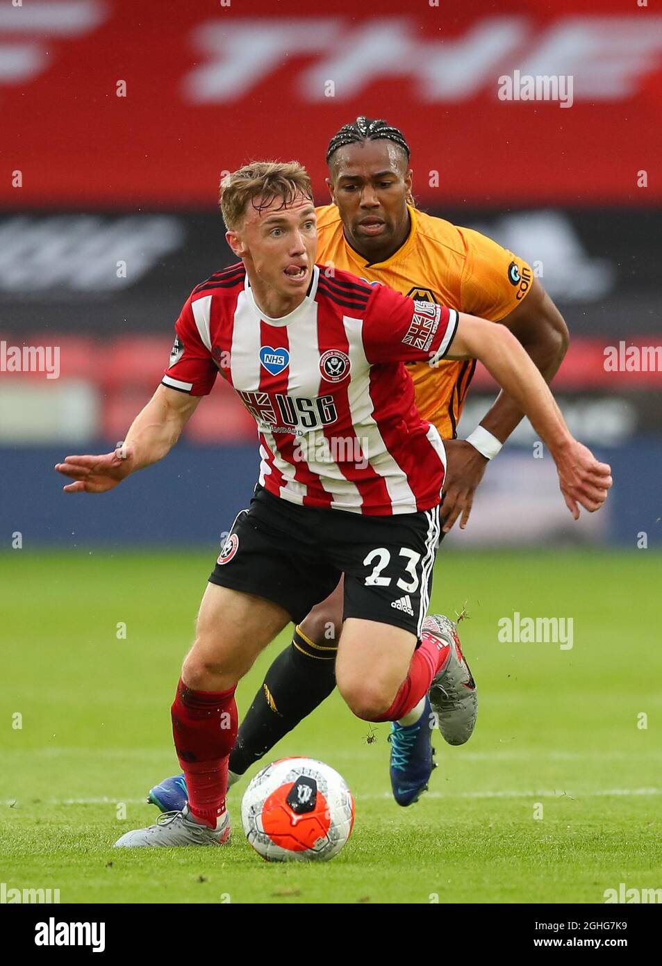 Ben Osborn of Sheffield Utd and Adama Traore of Wolverhampton Wanderers ...