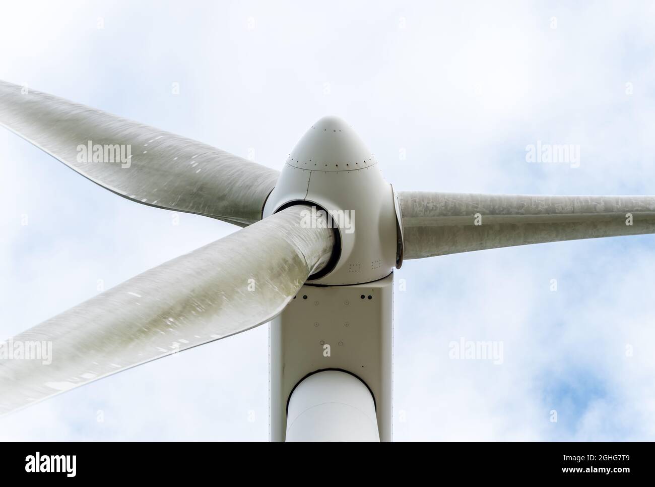Windmill turbine against cloudy sky - close-up Stock Photo - Alamy