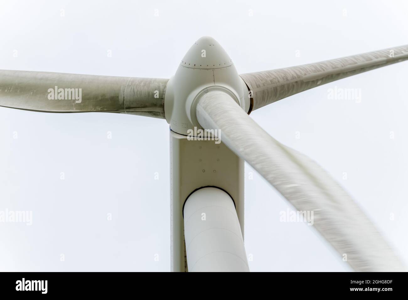 Windmill turbine against cloudy sky - close-up Stock Photo - Alamy