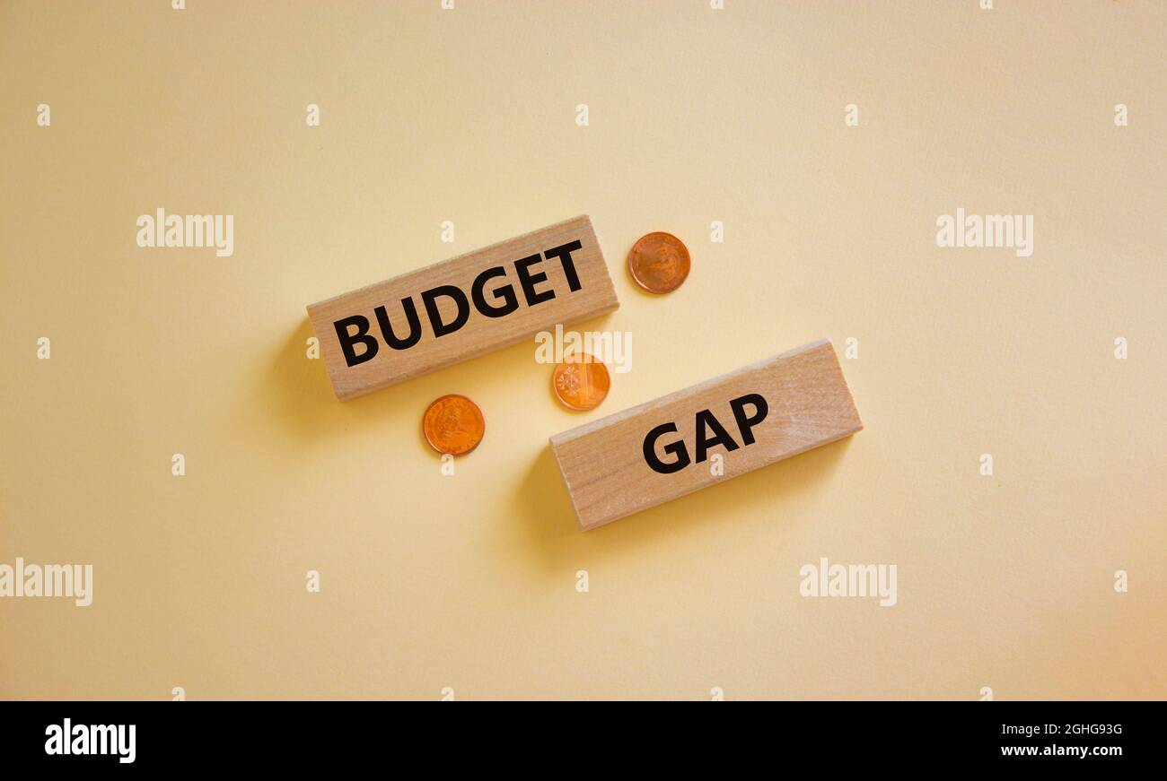 Budget gap symbol. Concept words 'budget gap' on wooden blocks on a ...