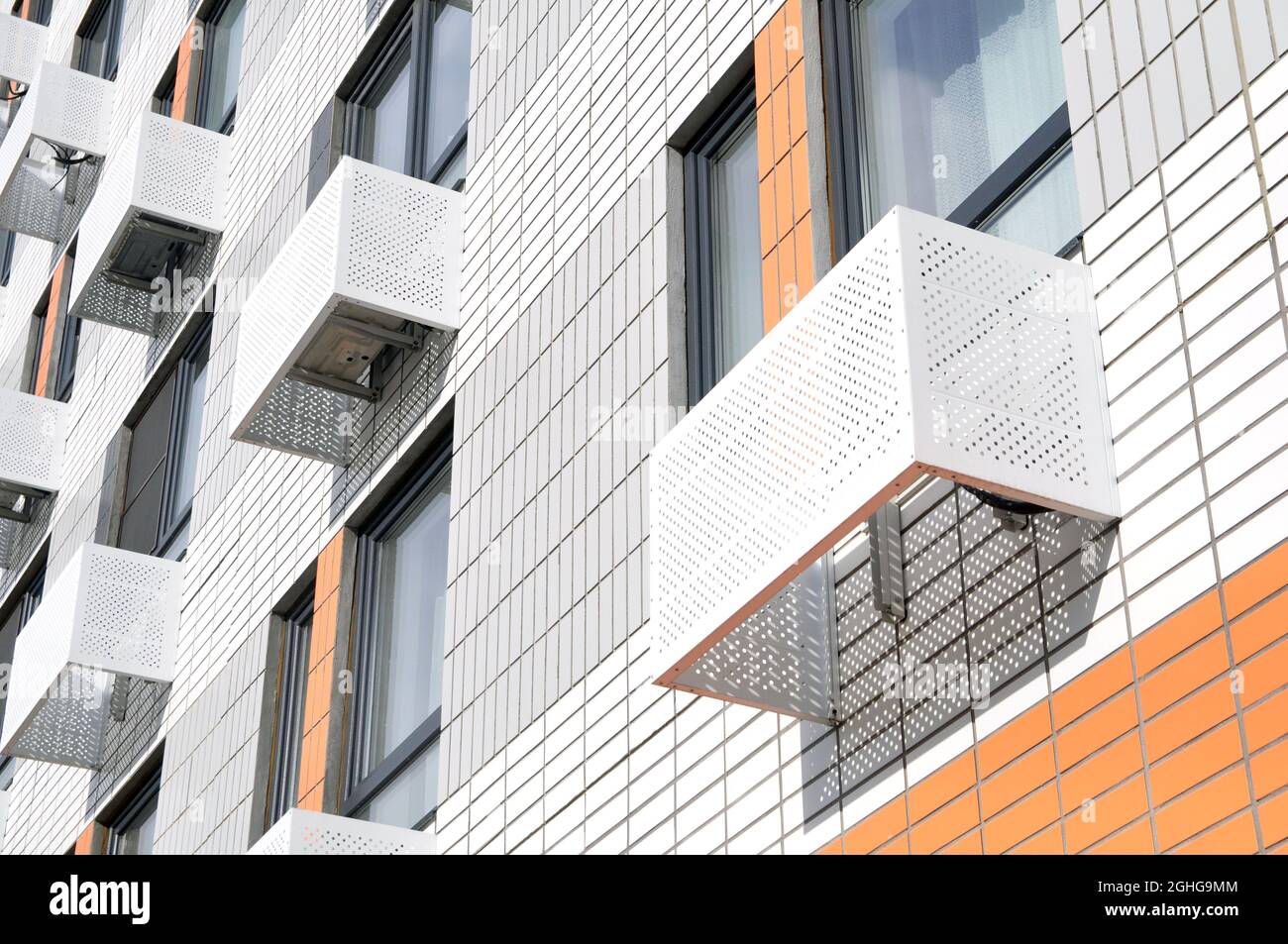 The facade of a new multi-storey residential building with windows and ...