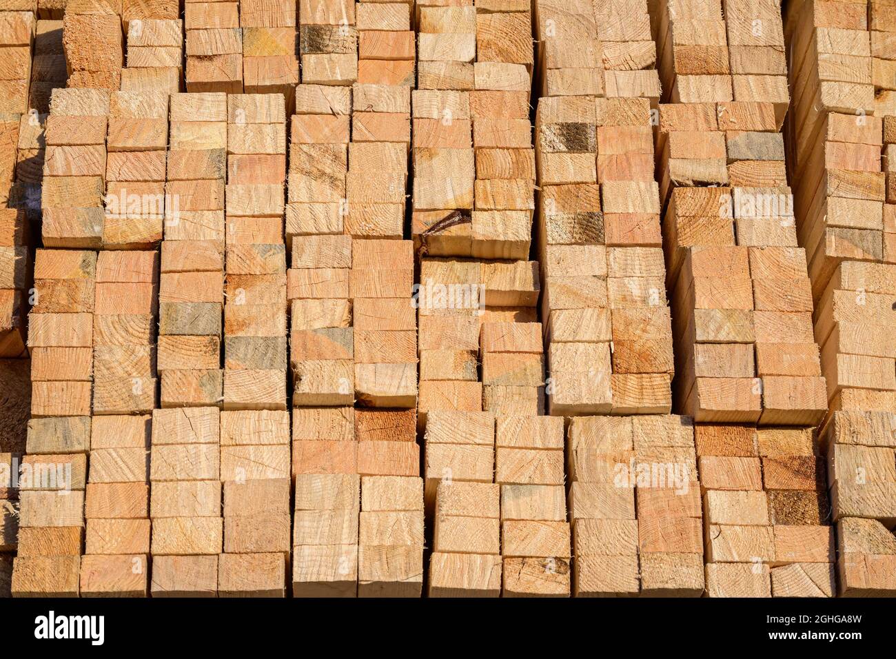 Piles of wooden planks at the sawmill for the manufacture of cladding ...