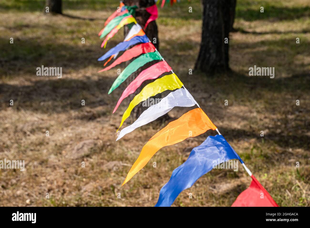 Colorful bunting flags. Decorations of colorful flags . Fair in the ...