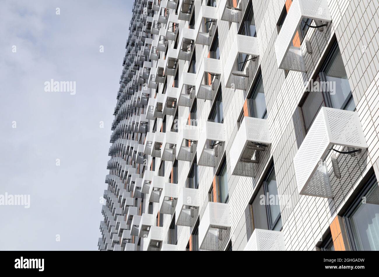 The facade of a new multi-storey residential building with windows and ...