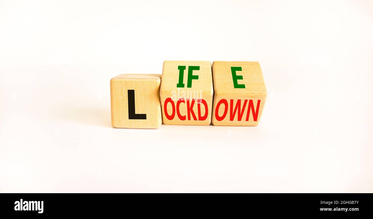 Life with lockdown symbol. Turned wooden cubes and changed words ...