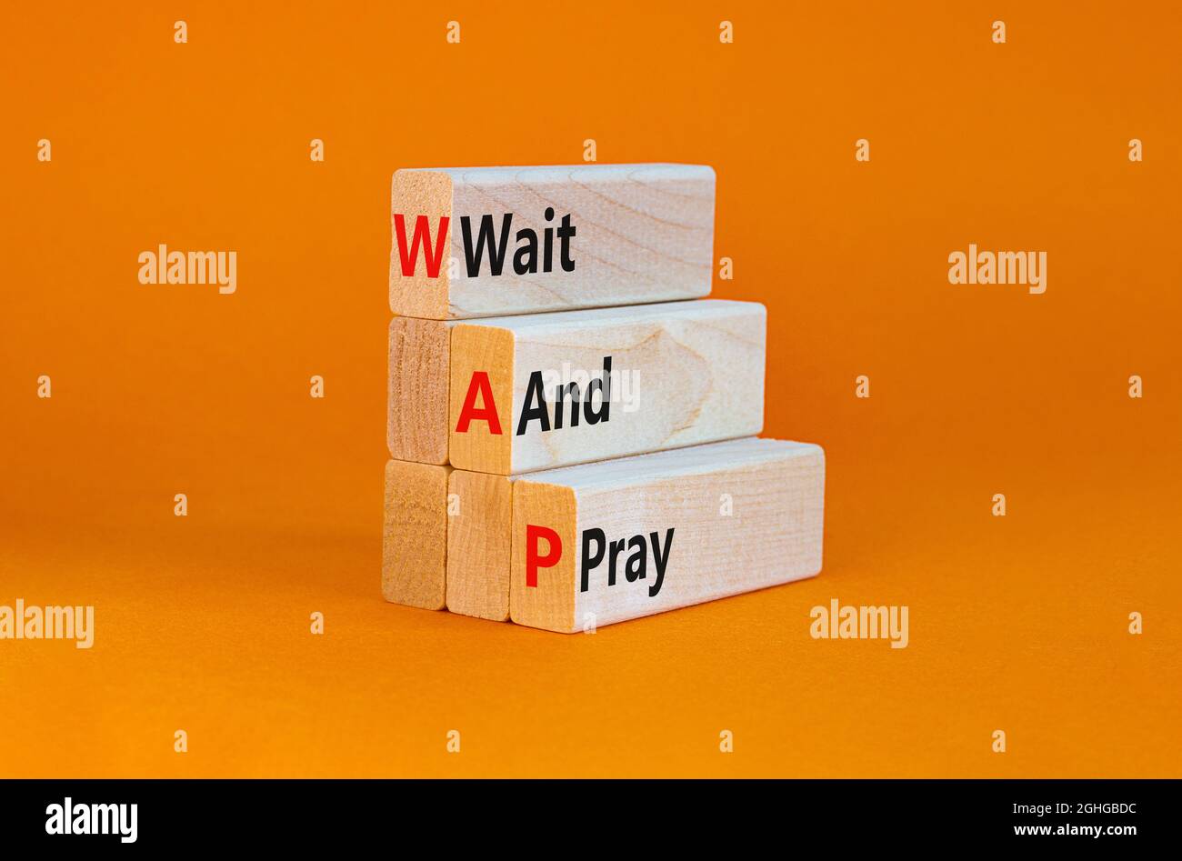 WAP, Wait and pray symbol. Wooden blocks with concept words 'WAP, Wait ...