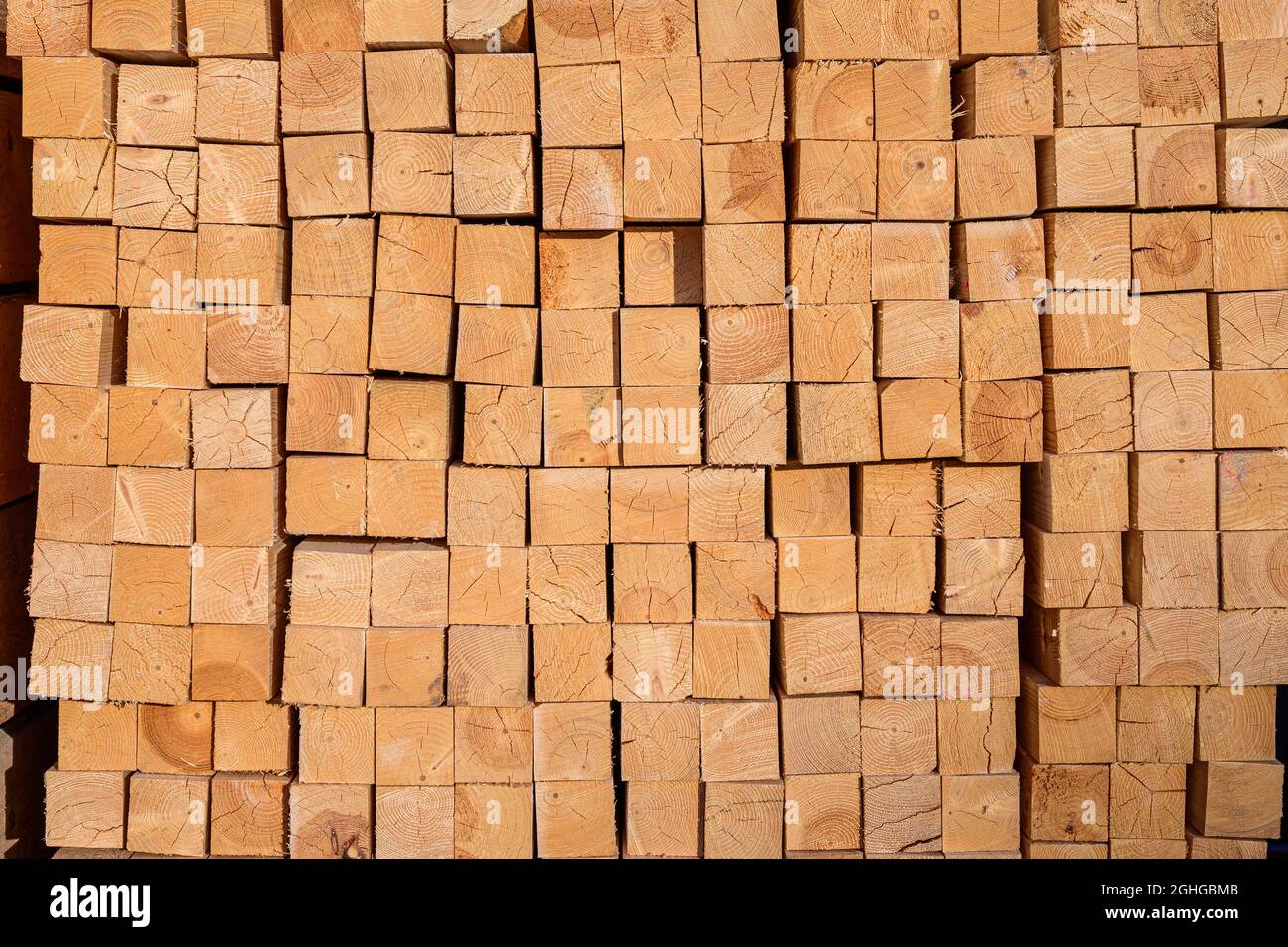 Piles of wooden planks at the sawmill for the manufacture of cladding ...