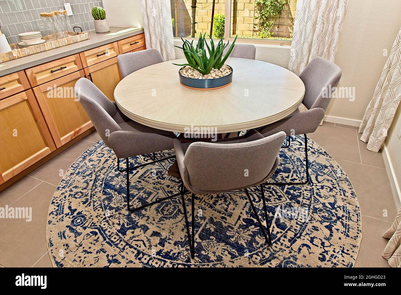 Round Dining Area Table With Five Chairs Stock Photo - Alamy