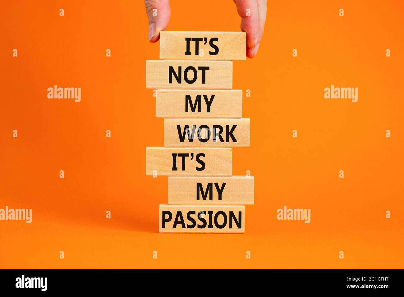 My work or passion symbol. Businessman hand. Wooden blocks with words ...
