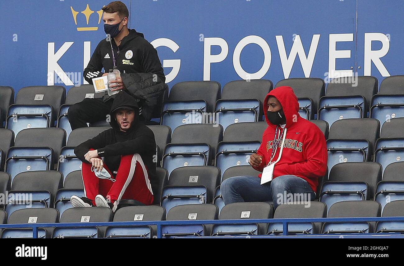 James Maddison and Wes Morgan of Leicester City sit in the stand during ...
