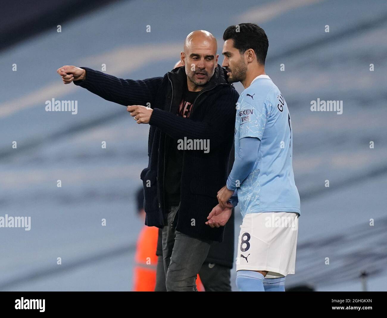 Josep Guardiola manager of Manchester City brings on Ilkay Gundogan of ...