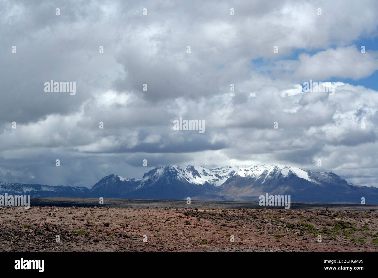 A snow-capped mountain with clouds, Peru Stock Photo - Alamy