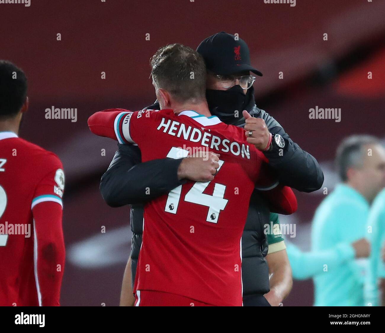 Jurgen Klopp manager of Liverpool hugs Jordan Henderson of Liverpool ...