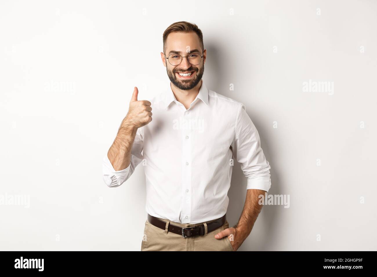 Satisfied successful boss showing thumb up, approve and praise good ...