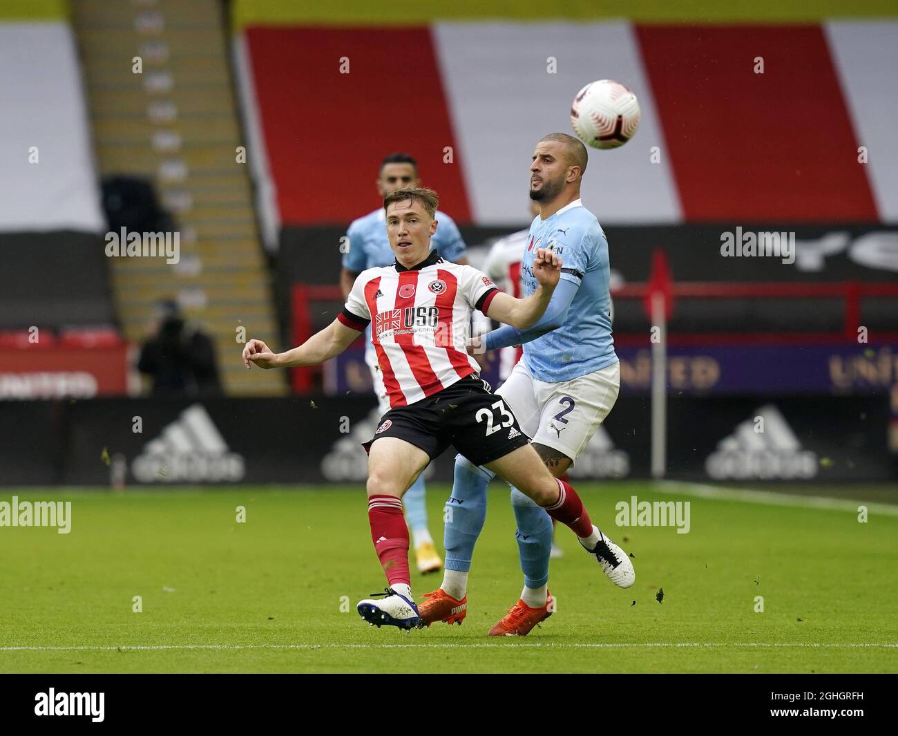 Sheffield United's Ben Osborn tussles with Manchester City's Kyle ...