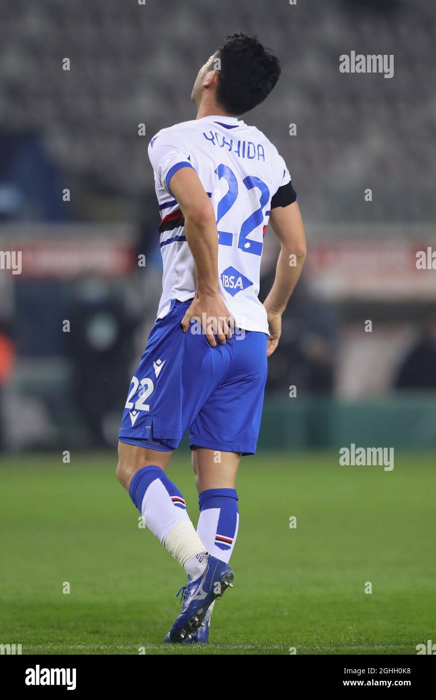 Maya Yoshida of UC Sampdoria grasps his gluteus after clashing with ...